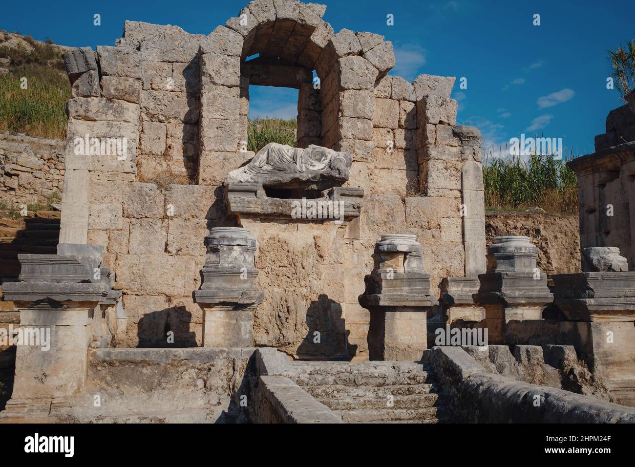 Ruins of Nymphaeum monumental water spring in ancient Greek city Perge ...