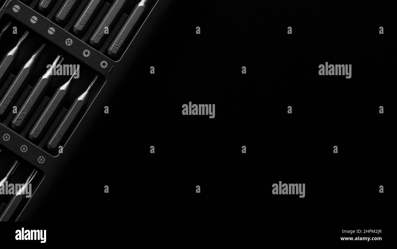 Screwdriver tips different shapes and sizes close up. Manual metal mini ...