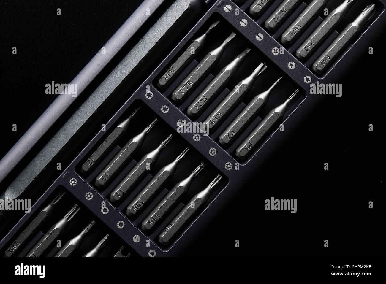 Screwdriver tips different shapes and sizes close up. Manual metal mini ...