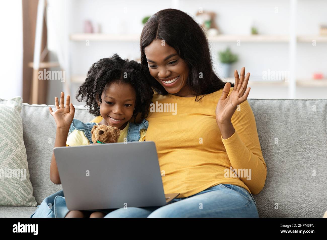 Black Mom And Female Child Making Video Call With Laptop At Home Stock ...