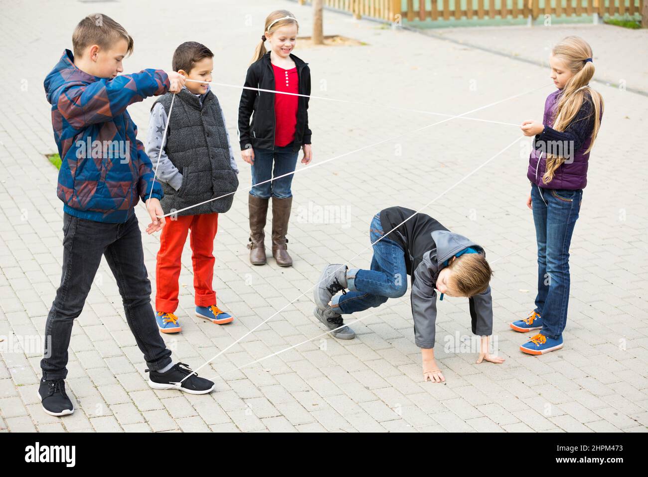 Children games with rubber rope Stock Photo - Alamy