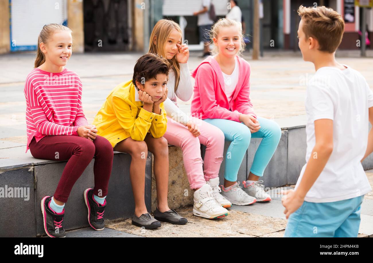 Kids talking on playground hi-res stock photography and images - Alamy