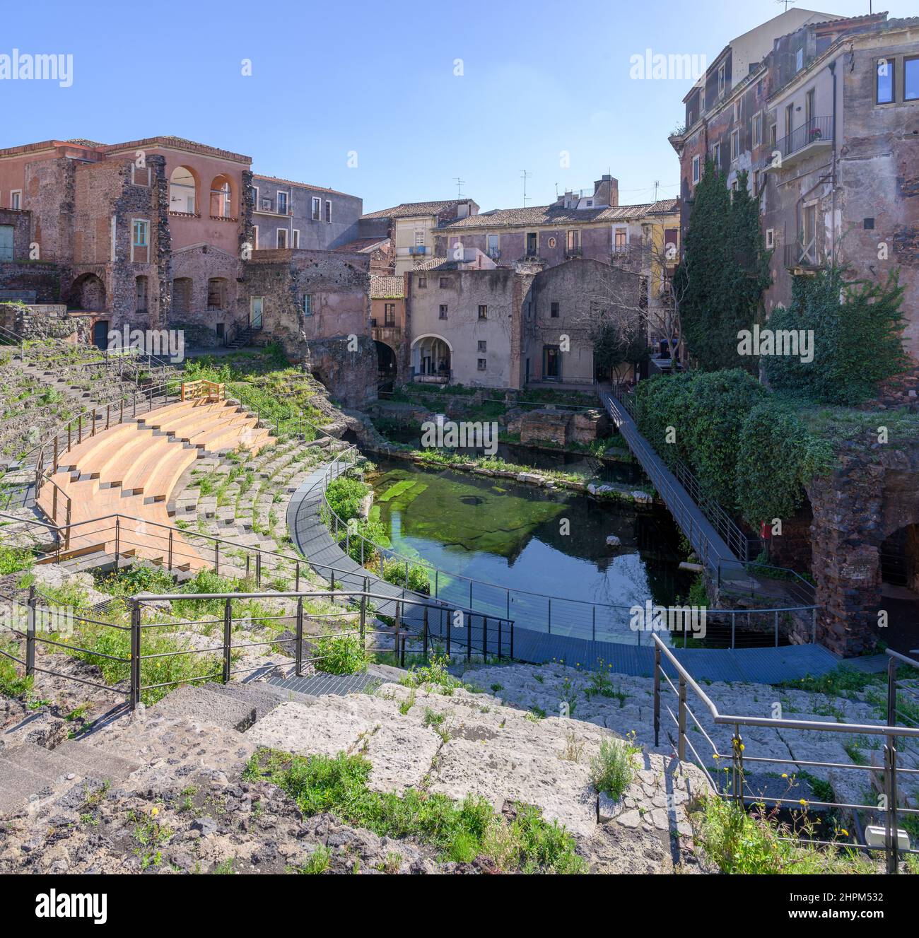 Old Roman amphitheater and Baroque style buildings, with a stage pond ...