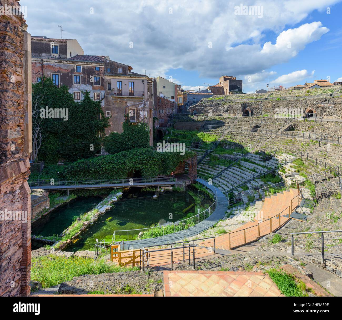 Old Roman amphitheater and Baroque style buildings, with a stage pond ...