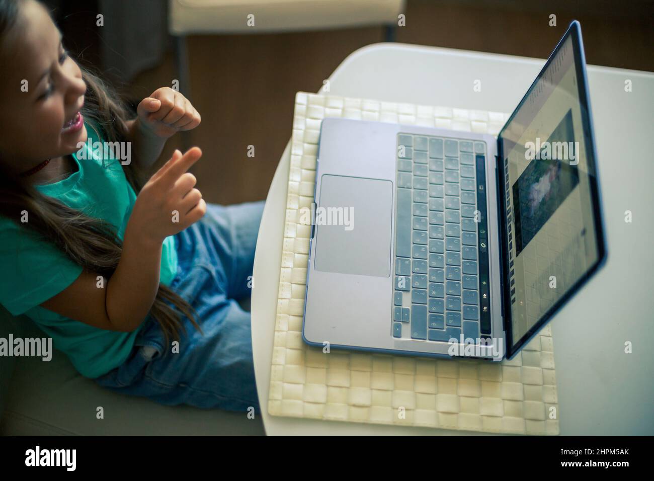 Little cute girl uses laptop to have video call Stock Photo - Alamy