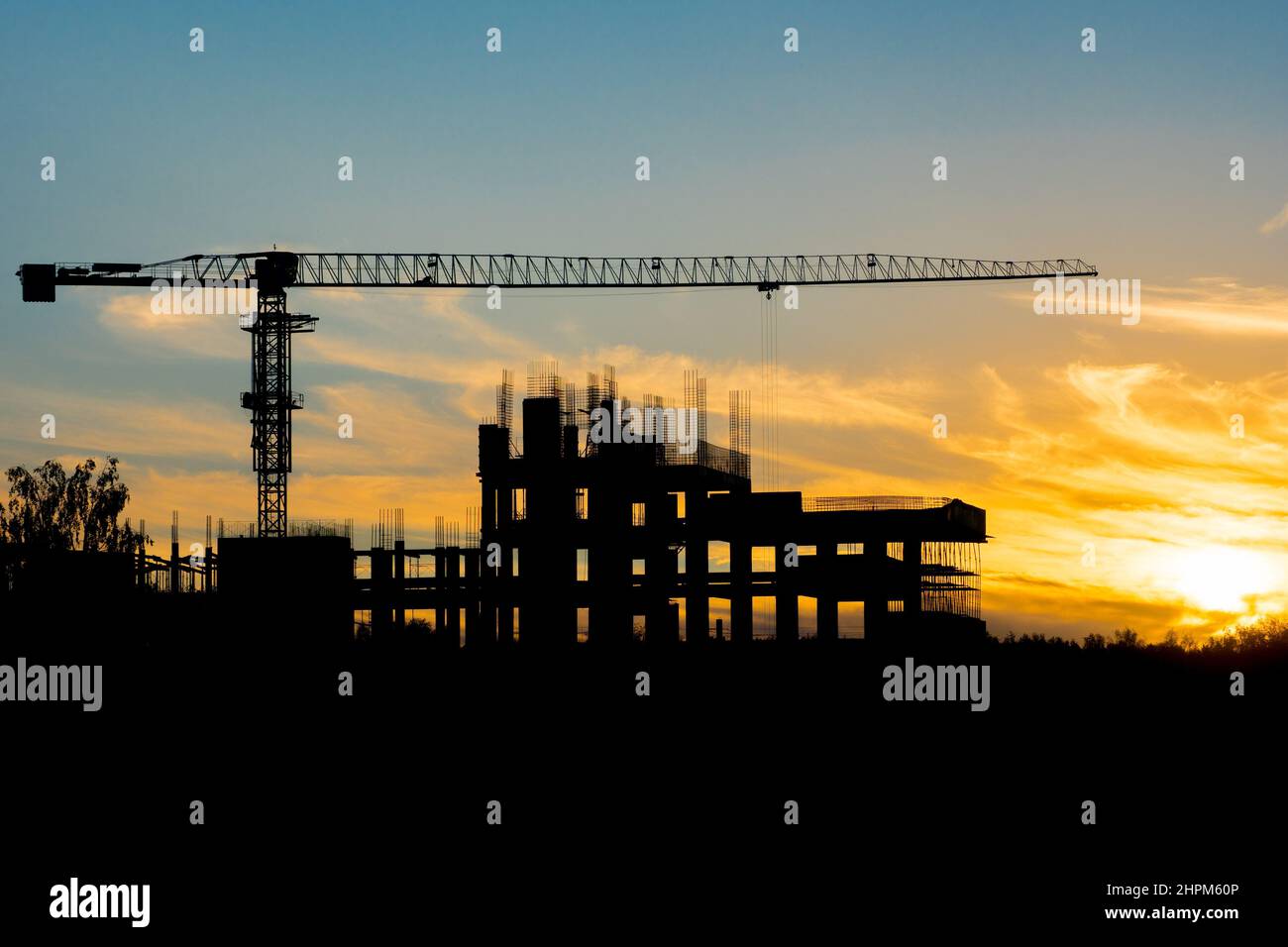 construction site and crane on sunset background Stock Photo - Alamy