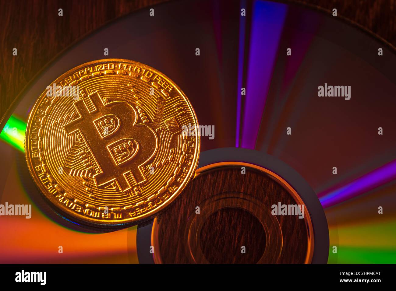 Bitcoin coin on a CD - DVD, background for design Stock Photo - Alamy