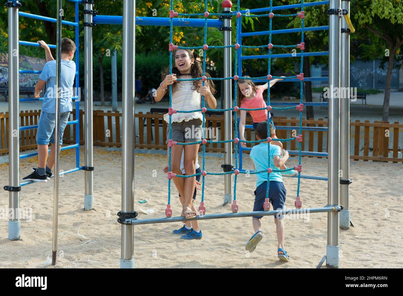 Glad children playing at the playground Stock Photo - Alamy