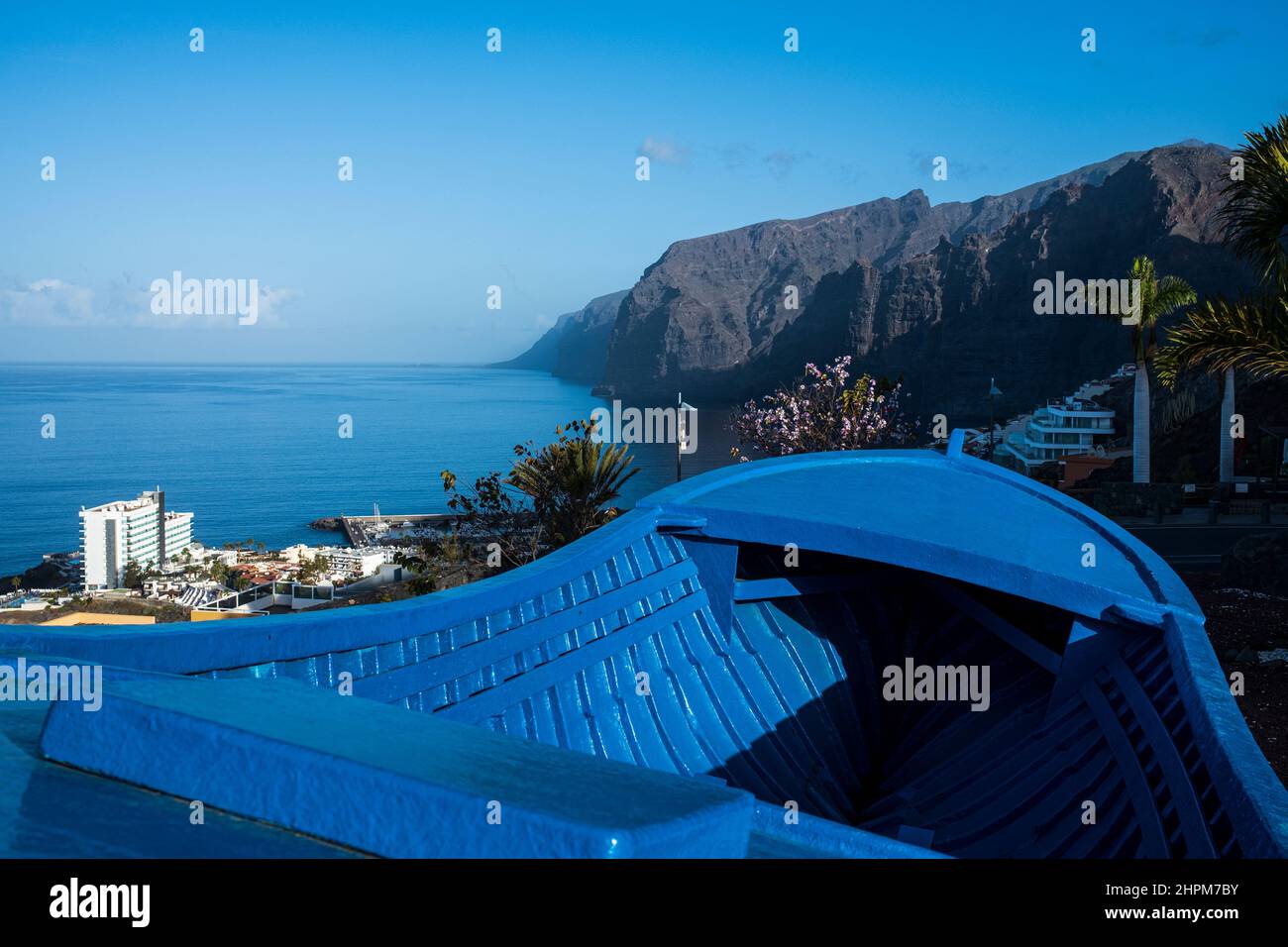 Old fishing boat and the cliffs of Los Gigantes at the Mirador de ...