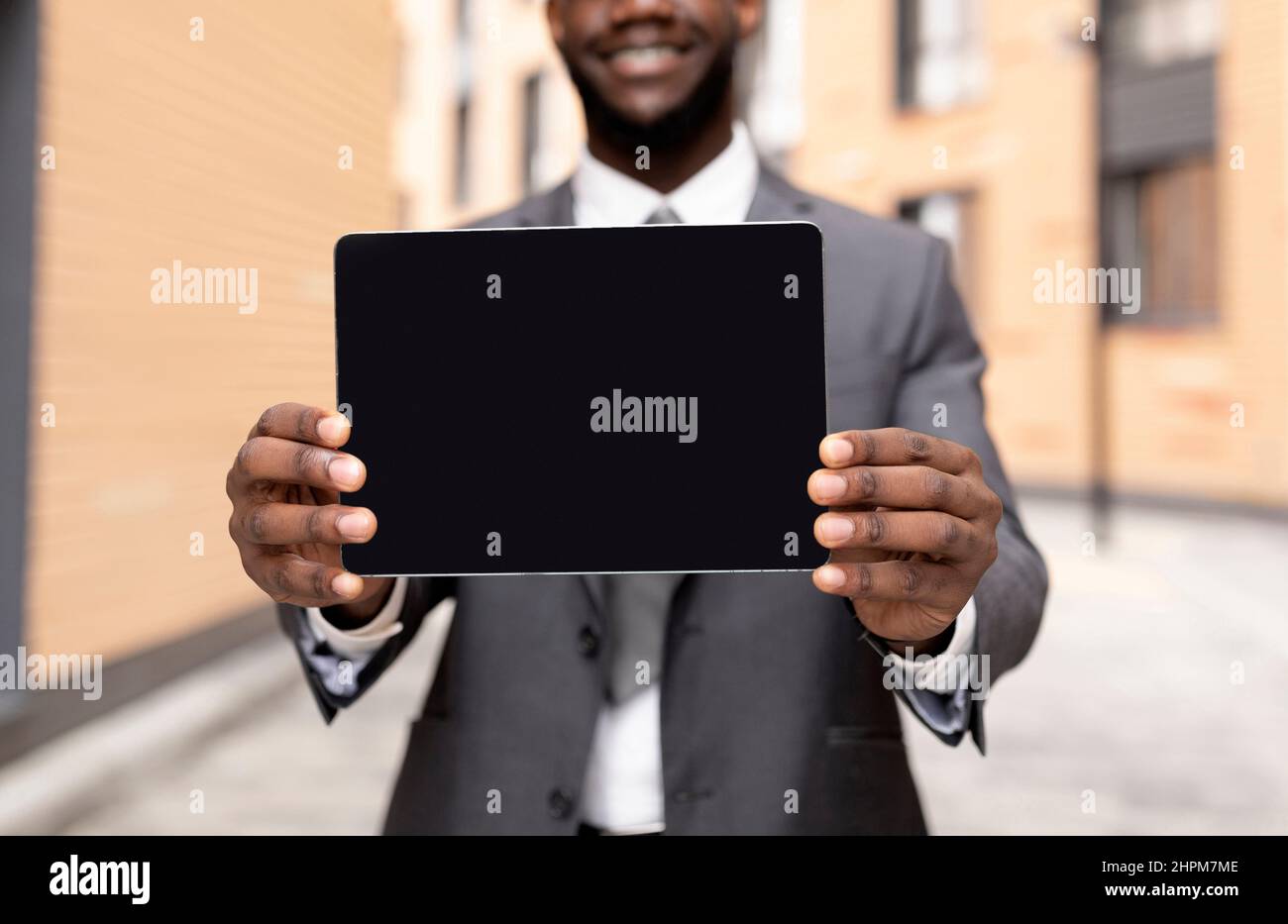 African american businessman demonstrating tablet with blank screen ...