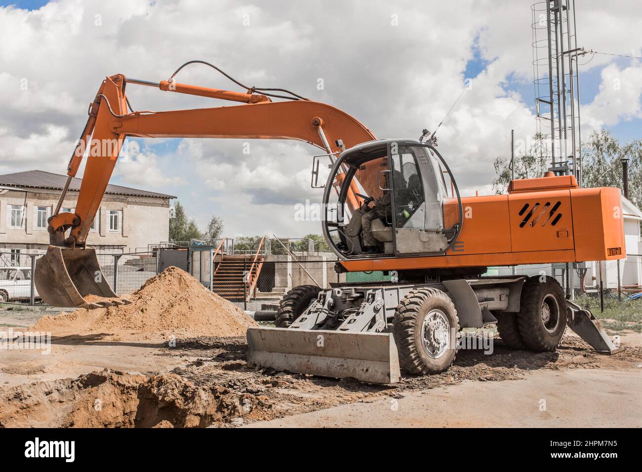Excavator digging heavy earth work on an industrial machine on a ...