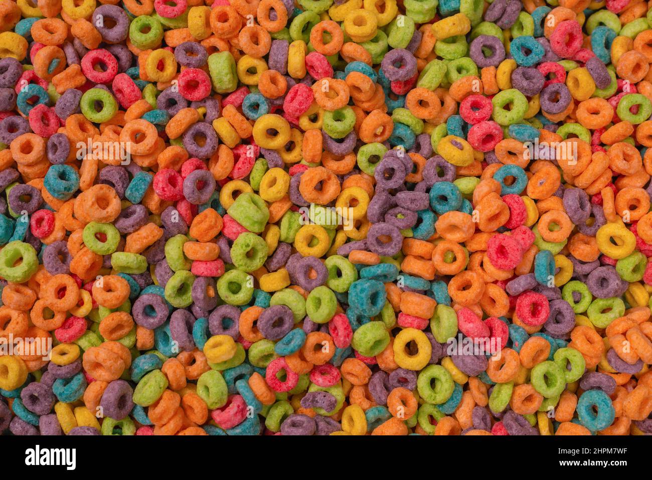 Sweet multicolored flakes, cereal loops as a background Stock Photo - Alamy