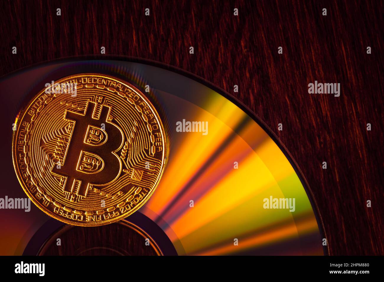Bitcoin coin on a CD - DVD, background for design Stock Photo - Alamy