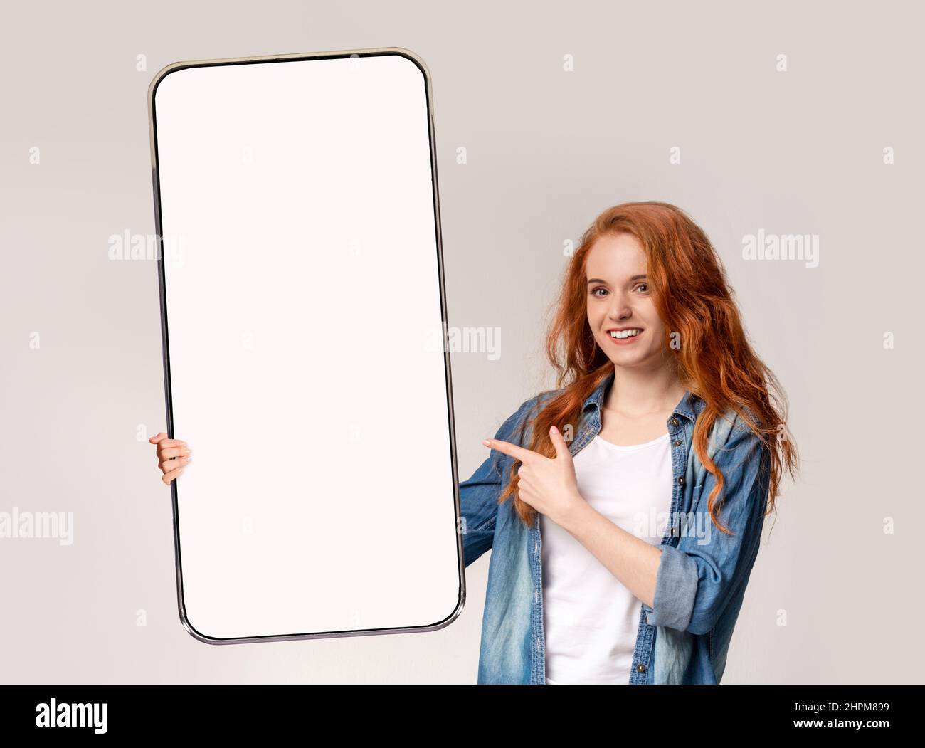 Excited woman showing empty hi-res stock photography and images - Alamy