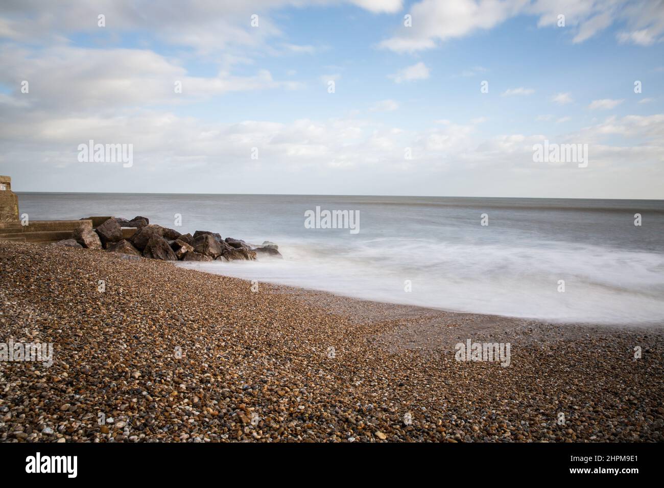 Pebble beach waves hi-res stock photography and images - Alamy