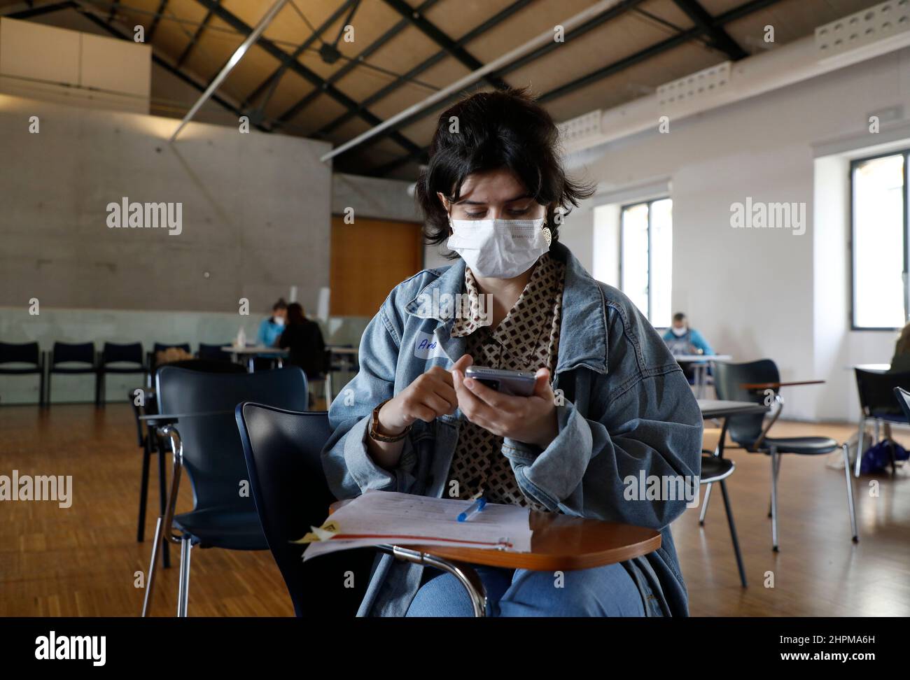 Palma, Spain. 22nd Feb, 2022. Applicant Ana looks at her phone just ...