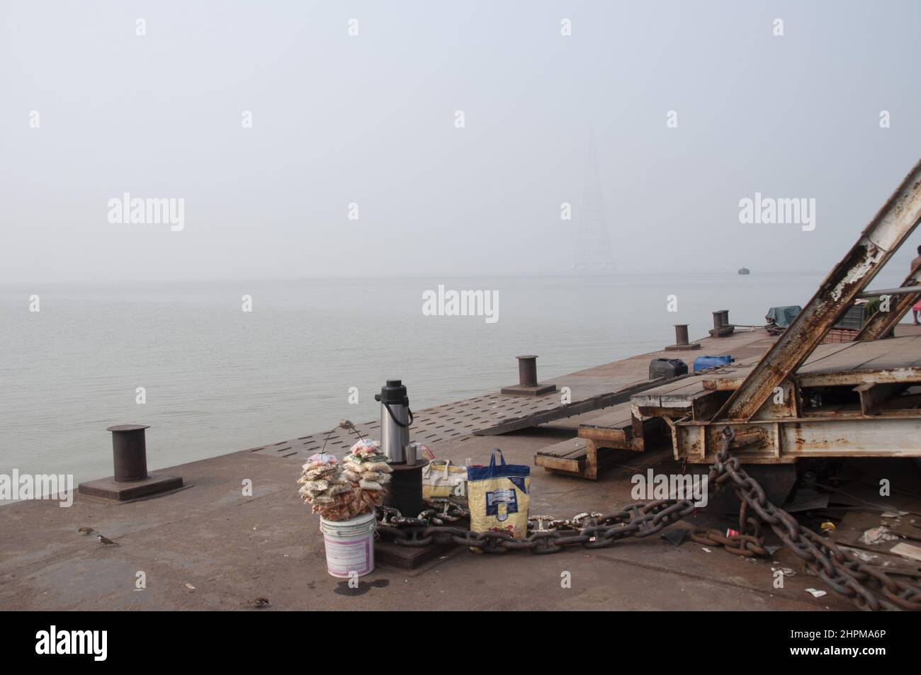 chain used to tie boat to dock or jetty with bank Stock Photo - Alamy