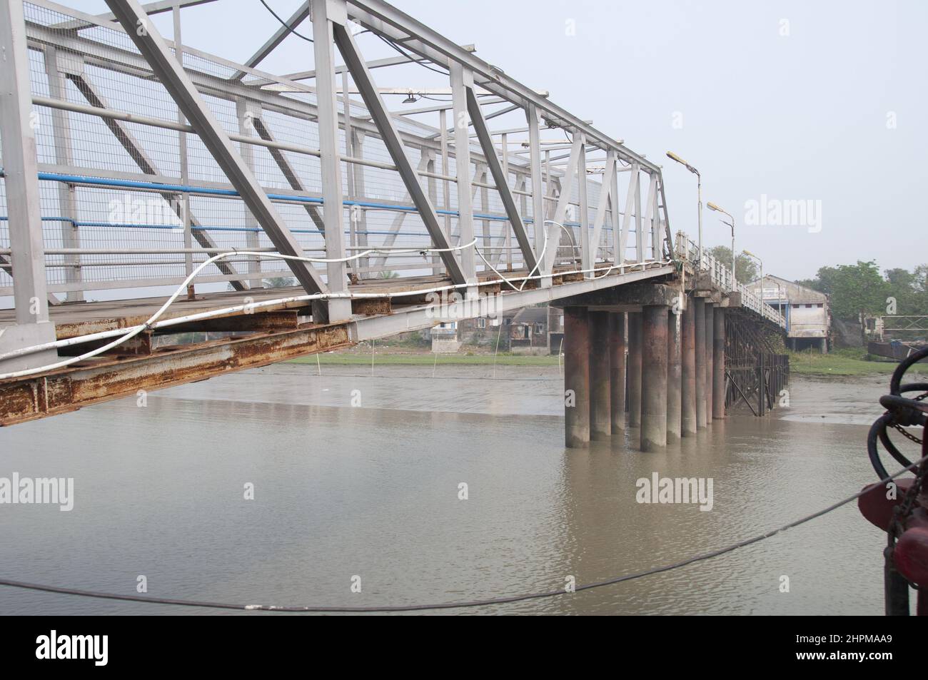 bridge that connects river to dock or jetty with bank Stock Photo - Alamy