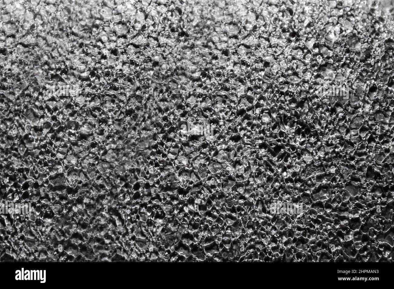 Close up photo of frozen concrete surface covered in ice texture ...