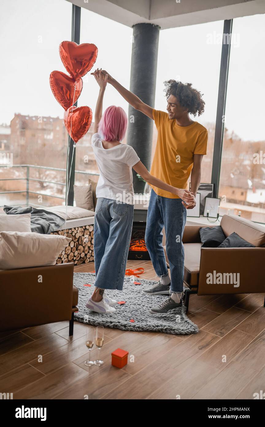 Young people dancing and feeling excited Stock Photo - Alamy