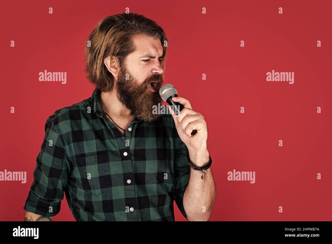Music is the universal language of mankind. bearded man in checkered ...