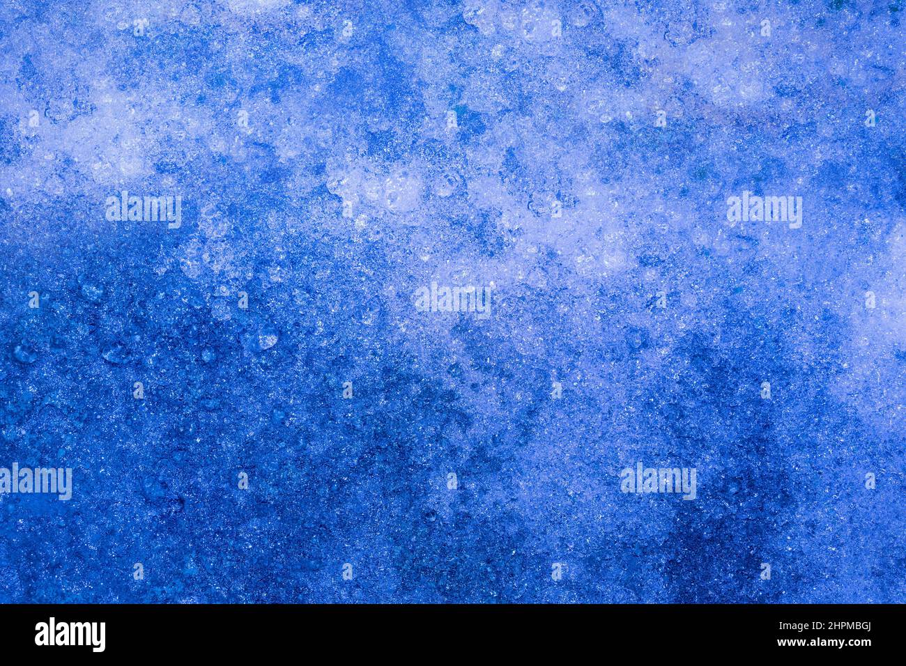 Photo of blue toned frozen snow covered in ice surface texture Stock ...
