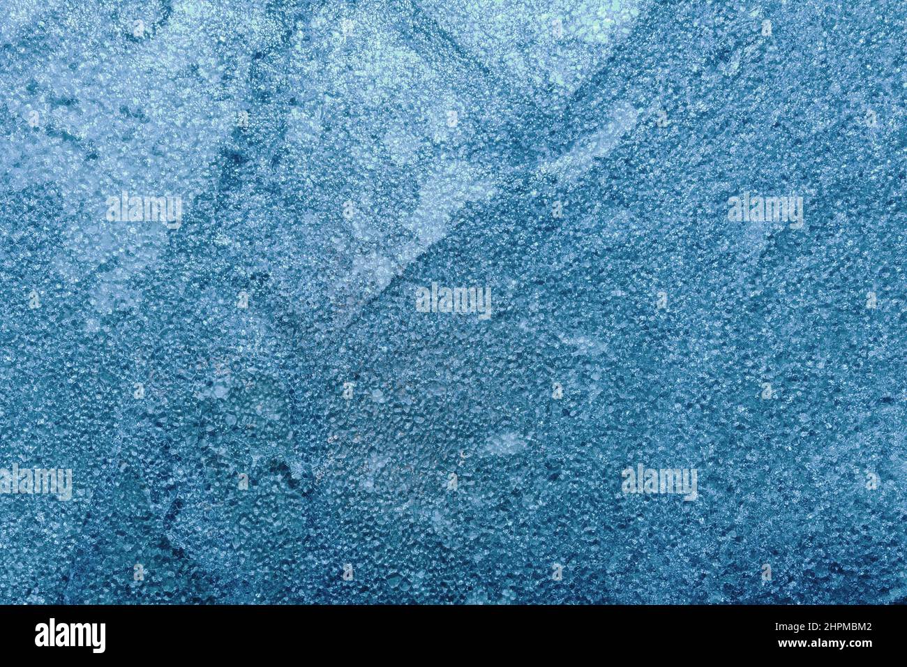 Photo of blue toned frozen concrete tile surface covered in ice texture ...