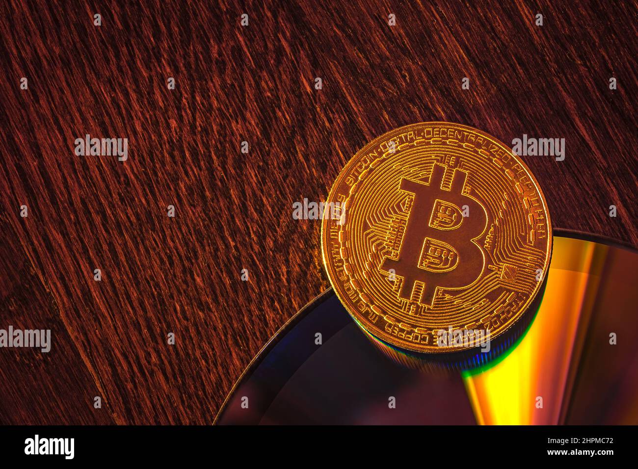 Bitcoin coin on a CD - DVD, background for design Stock Photo - Alamy