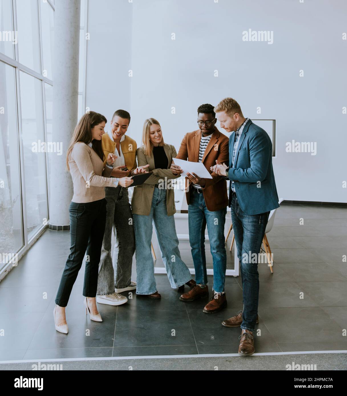 Young creative team working together in the modern office Stock Photo ...