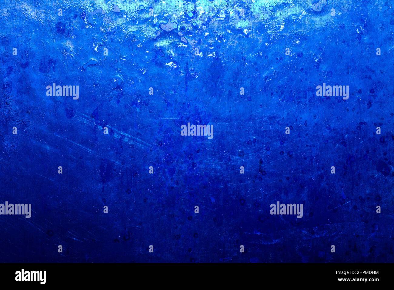 Photo of blue toned frozen metal sheet covered in ice surface texture ...