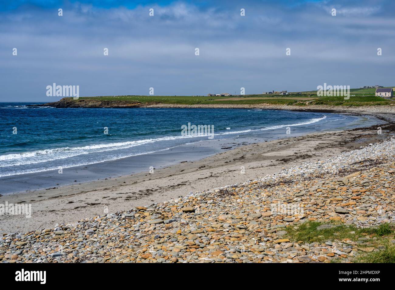 View looking north across Bay of Skaill with St Peter’s Kirk in the ...
