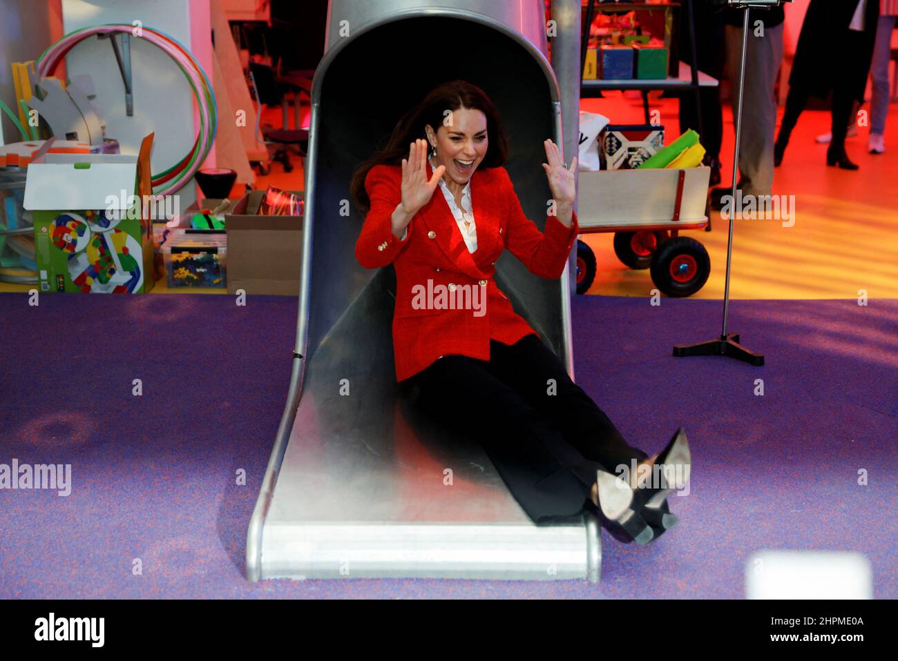 The Duchess of Cambridge comes down a slide during a visit to the LEGO ...