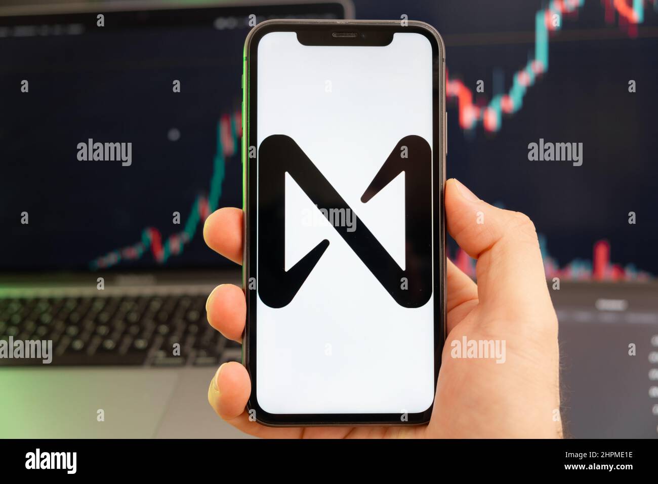 NEAR Protocol cryptocurrency logo on the screen of a smartphone in mans ...
