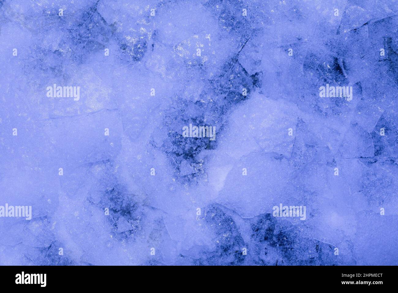 Photo of blue toned frozen cracked ice ground texture Stock Photo - Alamy