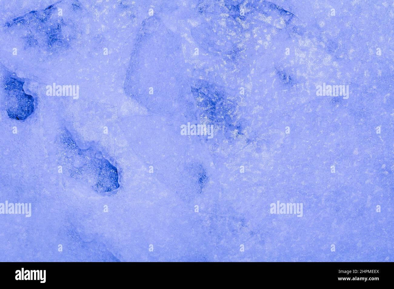 Photo of blue toned frozen cracked ice ground texture Stock Photo - Alamy