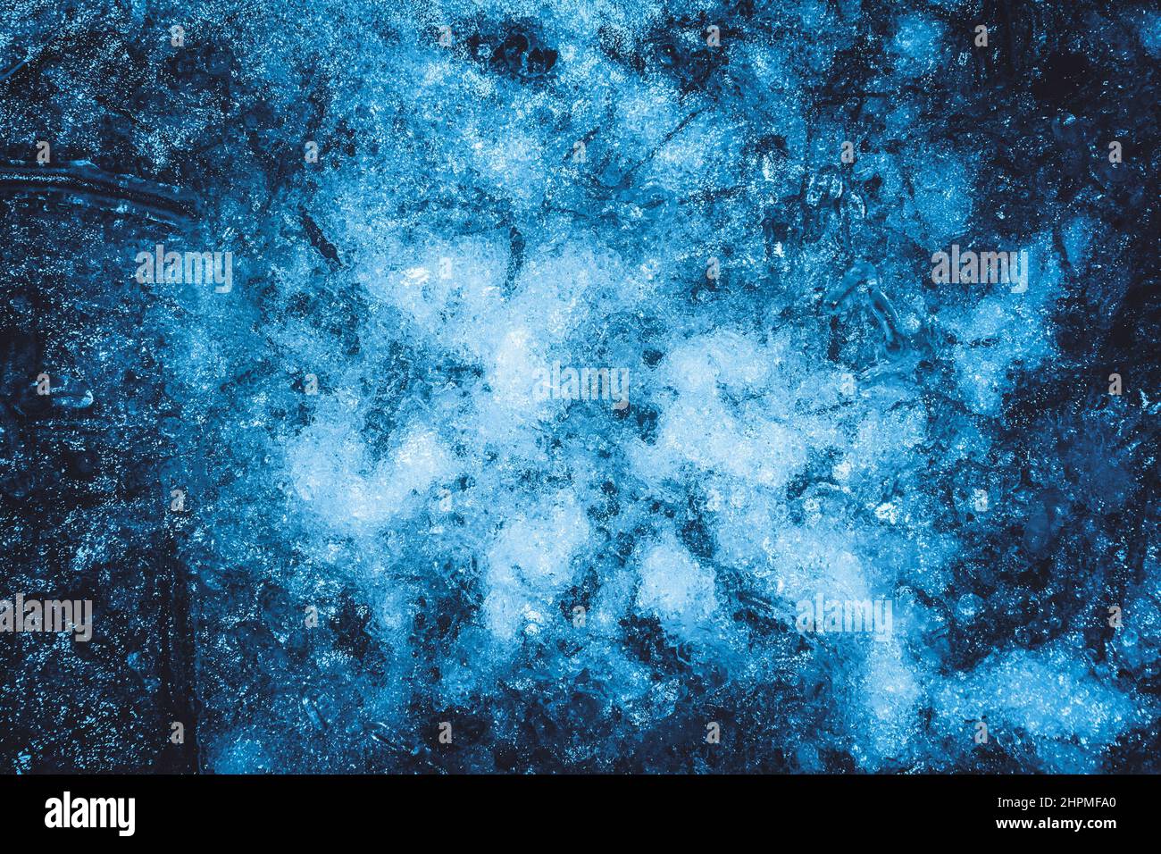 Photo of blue toned frozen ground covered in ice texture Stock Photo ...