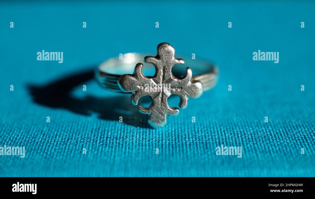 Little silver cross ring Stock Photo - Alamy