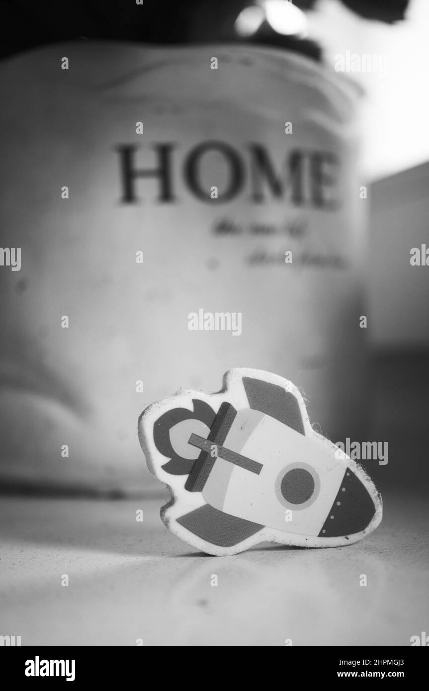 Rocket-shaped object standing next to a flower pot Stock Photo - Alamy