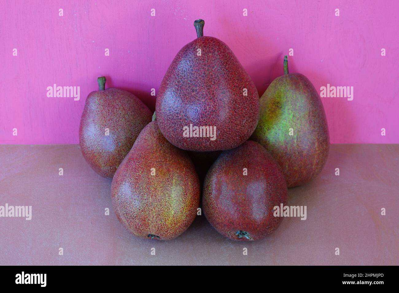 Group of red pear fruit with stem Stock Photo - Alamy