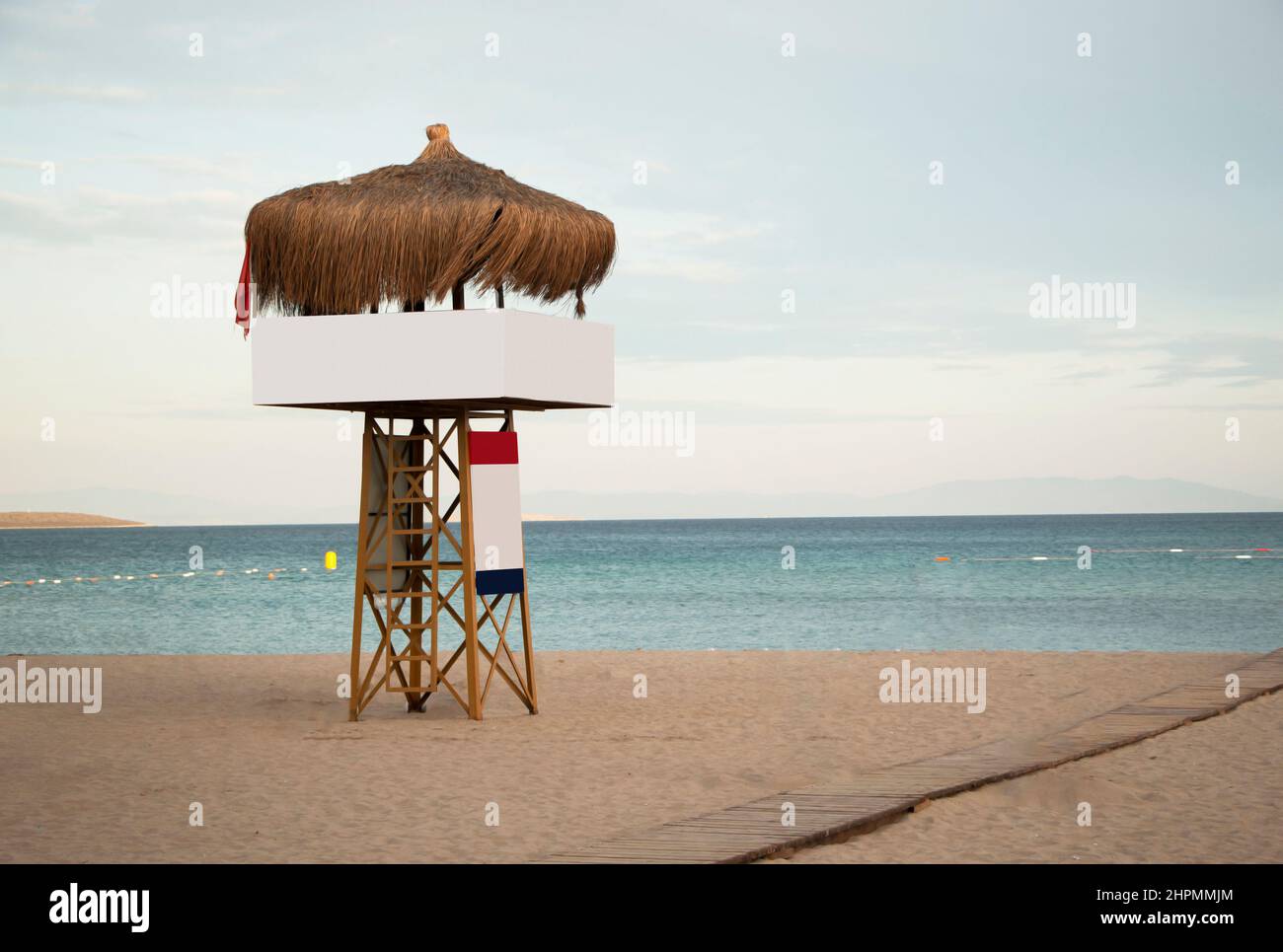 Lifeguard cabine at the beach. Sea and beach under the clear sky ...