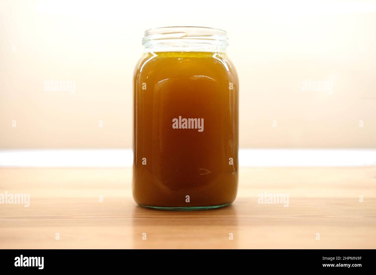 jar of beef bone broth on wooden kitchen toable top Stock Photo - Alamy