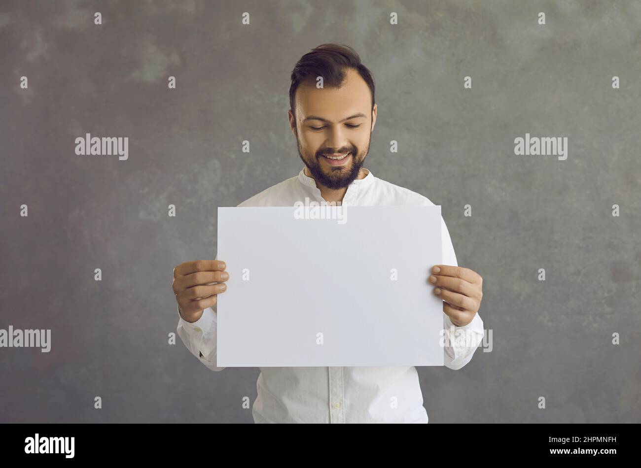 Holding blank sheet of paper hi-res stock photography and images - Alamy