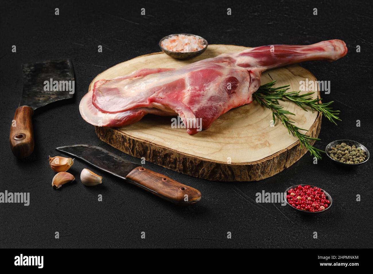 Raw fresh lamb shoulder on black background Stock Photo - Alamy