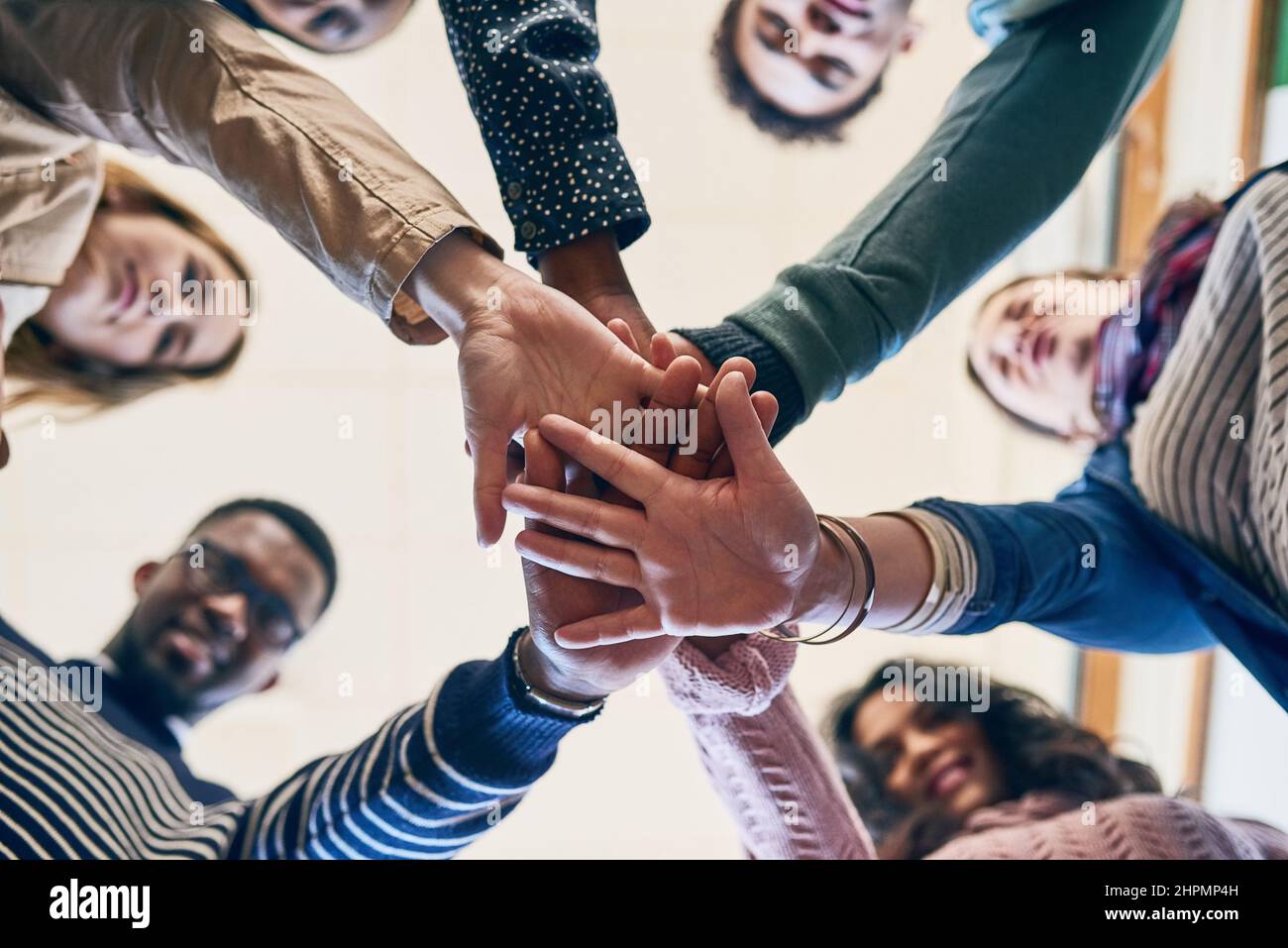 Theres power in unity. Low angle portrait of a group of young friends ...