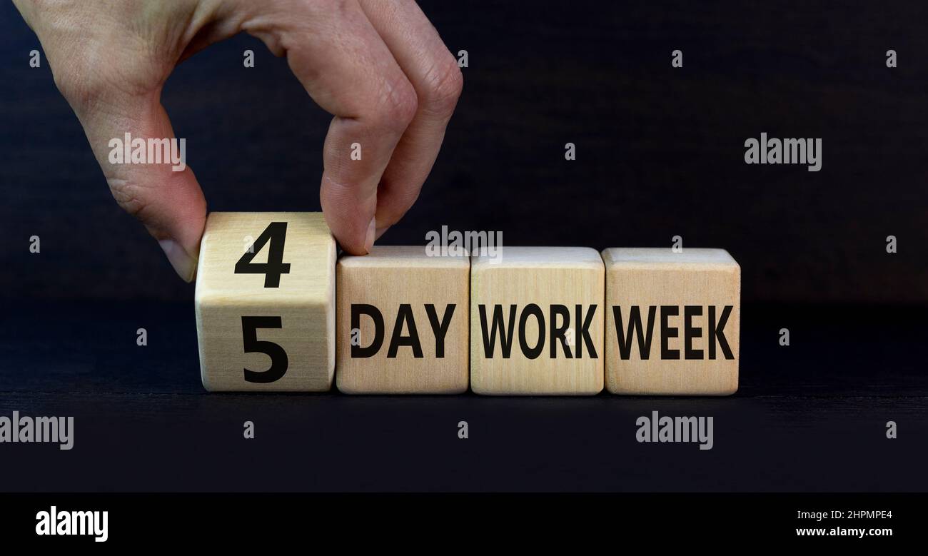 4 or 5 day work week symbol. Businessman turns cubes and changes words ...