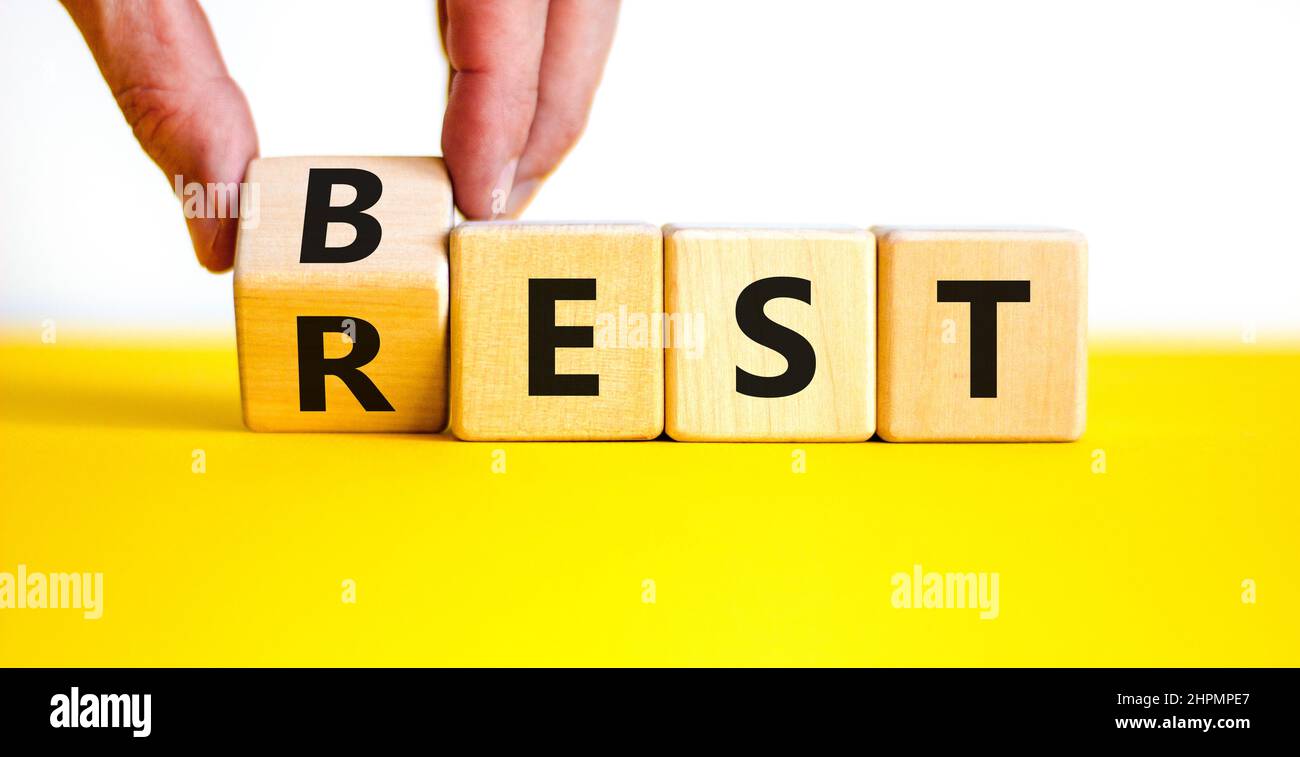 Best rest symbol. Businessman turns wooden cubes and changes the word ...