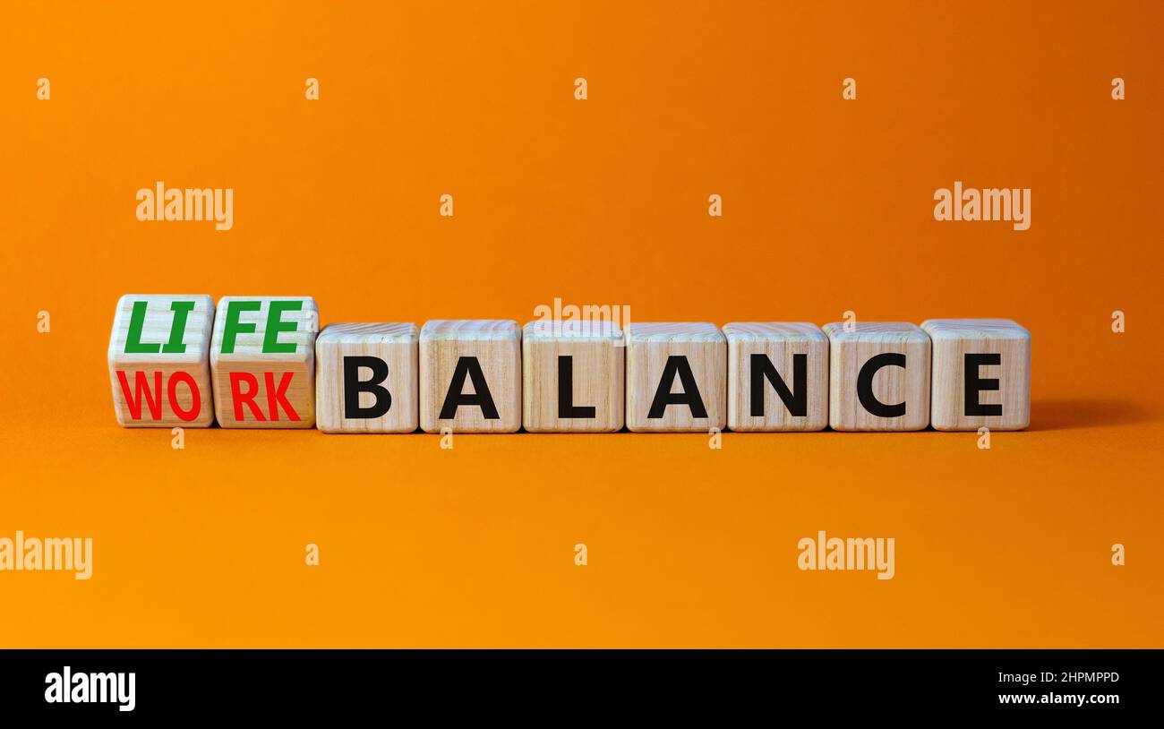 Work life balance symbol. Turned wooden cubes and changed concept words ...