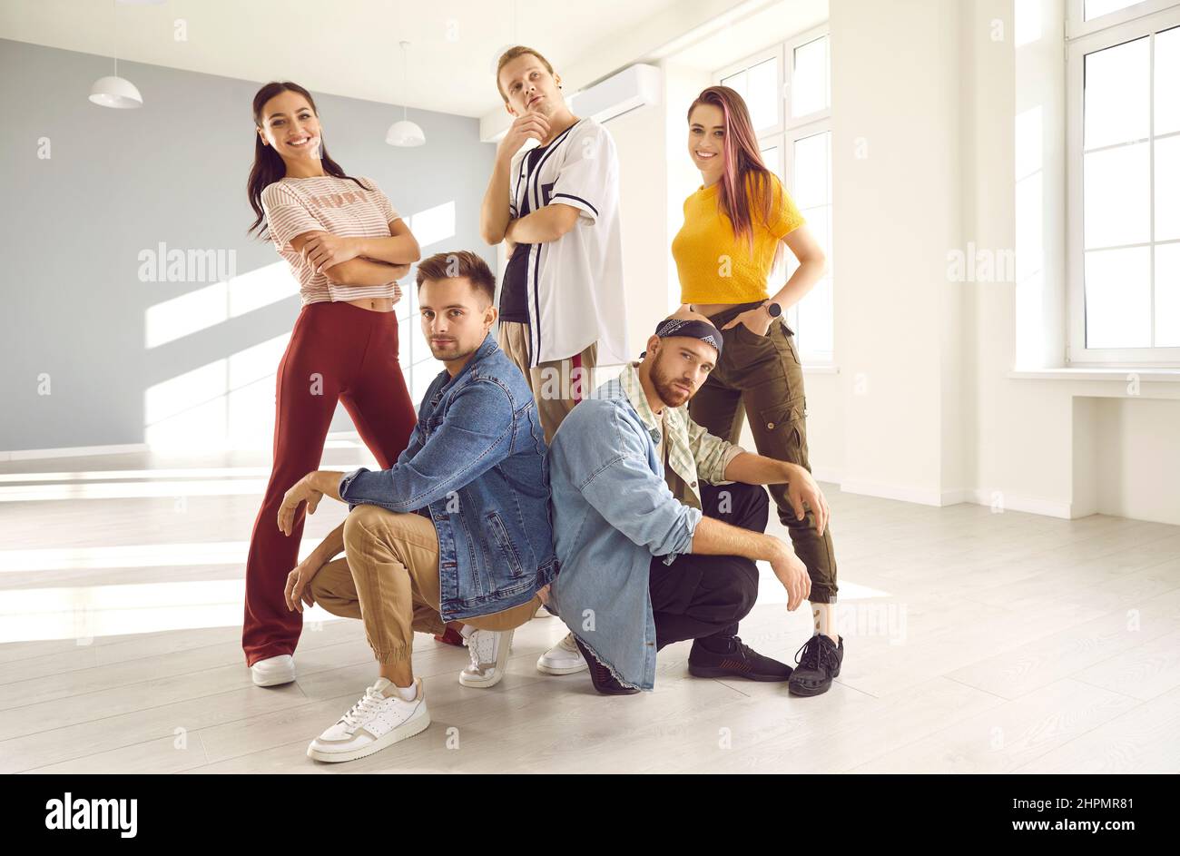 Young hip hop dance crew members in casual clothes posing in their ...