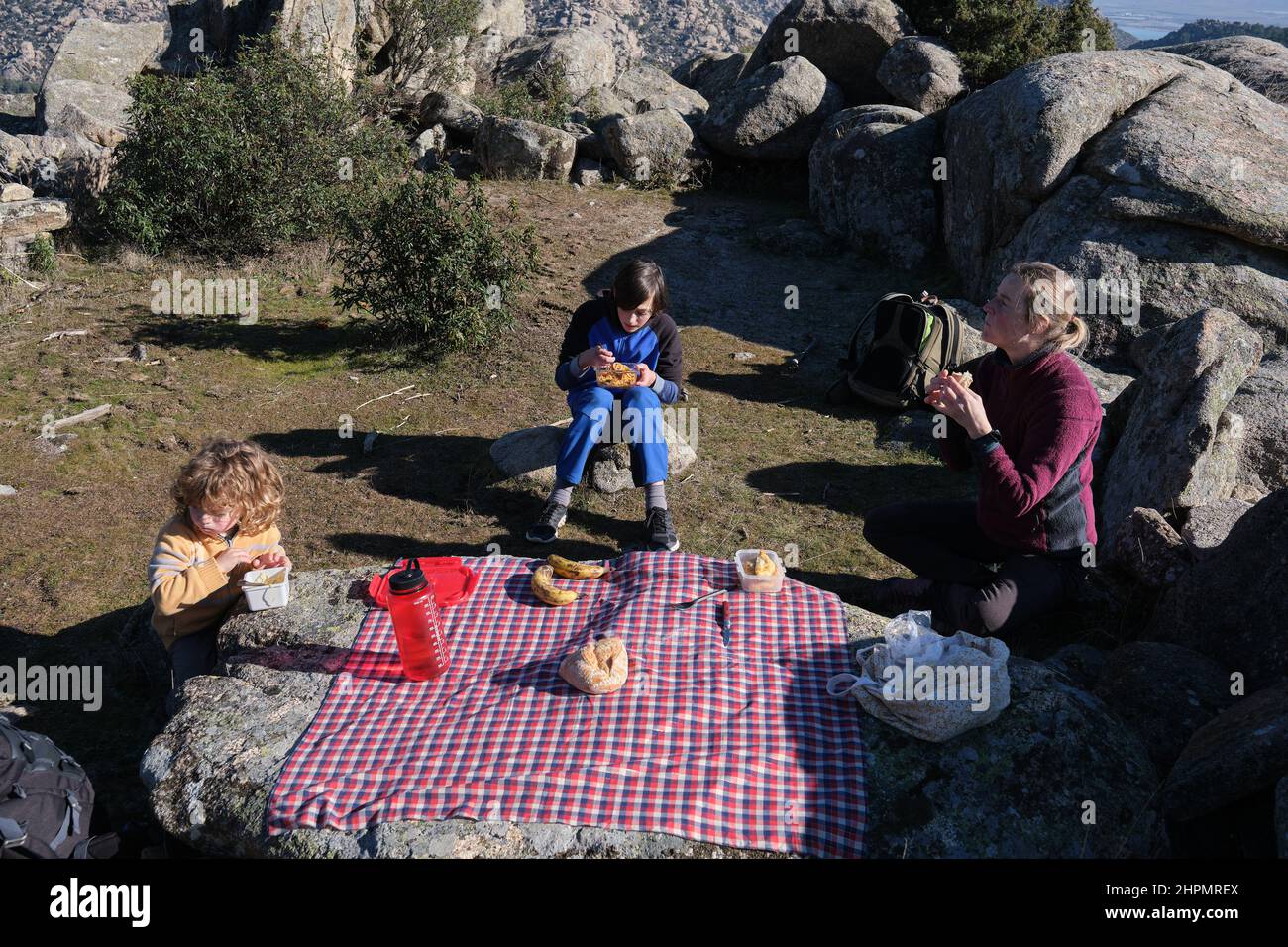 A family hiker having a lunch break on the nature Stock Photo - Alamy
