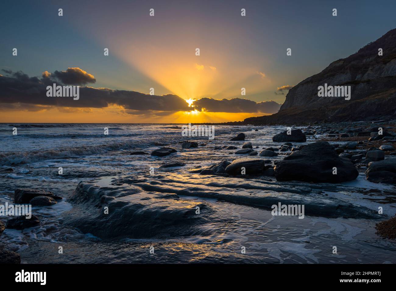 Seatown, Dorset, UK. 22nd February 2022. UK Weather. Beams of sunlight ...
